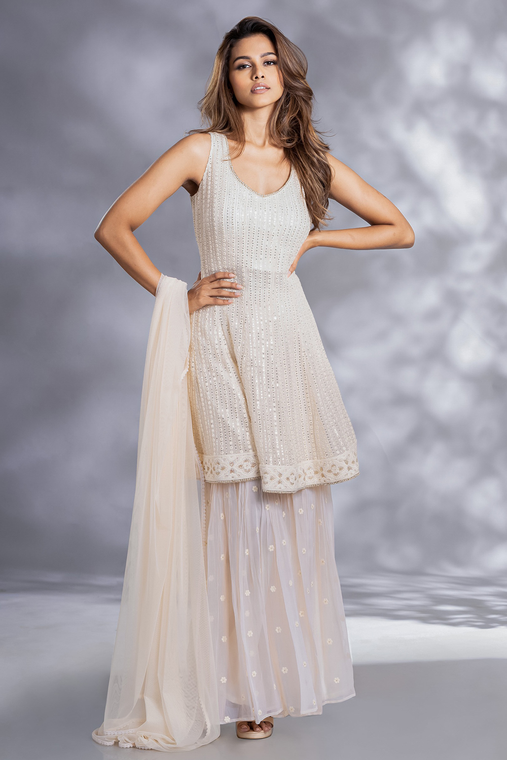 IVORY WHITE SHARARA PANT SET WITH A SELF THREAD PATTERN PAIRED WITH A ...